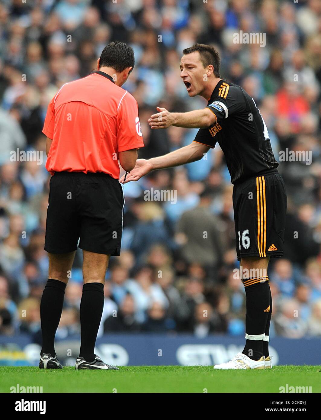 Chelseas john terry and referee andre marriner hi-res stock photography ...