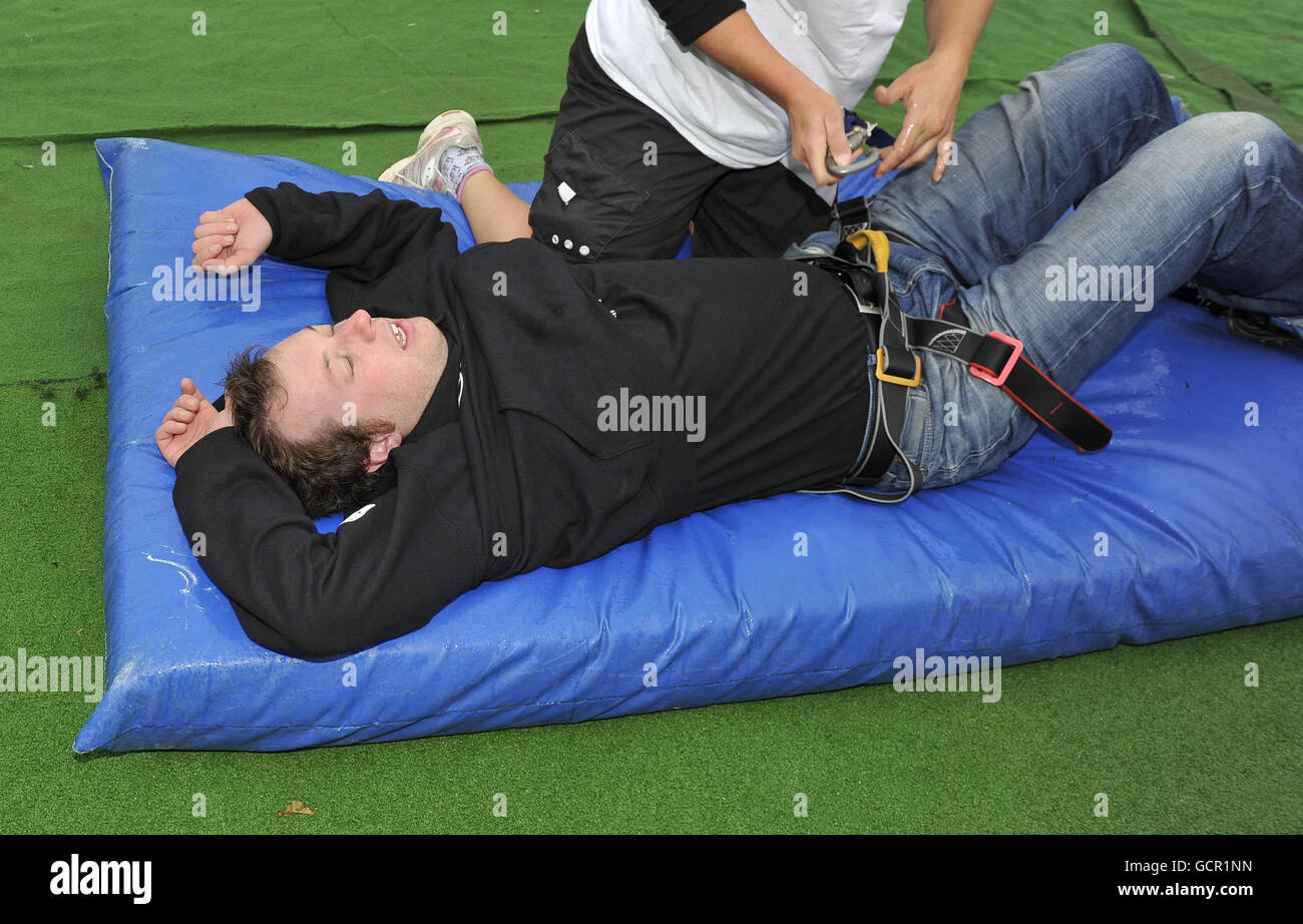 James Field lies exhausted after his record breaking 42nd bungee jump ...