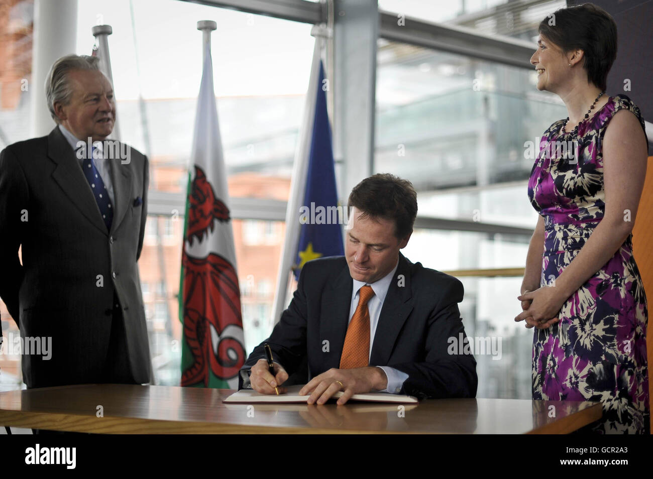 The Deputy Prime Minister Nick Clegg signs a book inside the Welsh ...