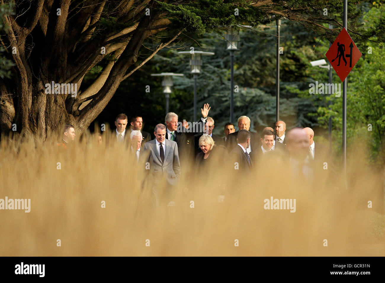 Former US President Bill Clinton waves to students at University ...
