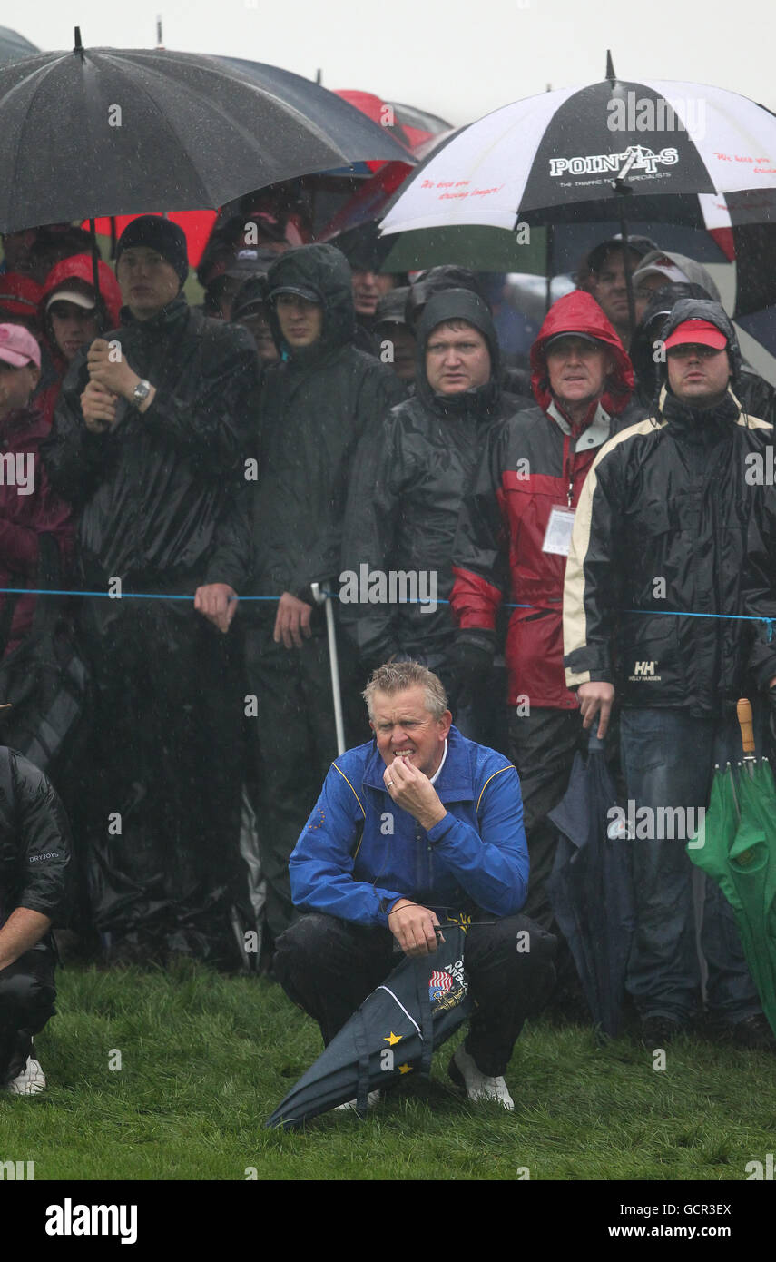European captain Colin Montgomerie stands in the pouring rain Stock ...