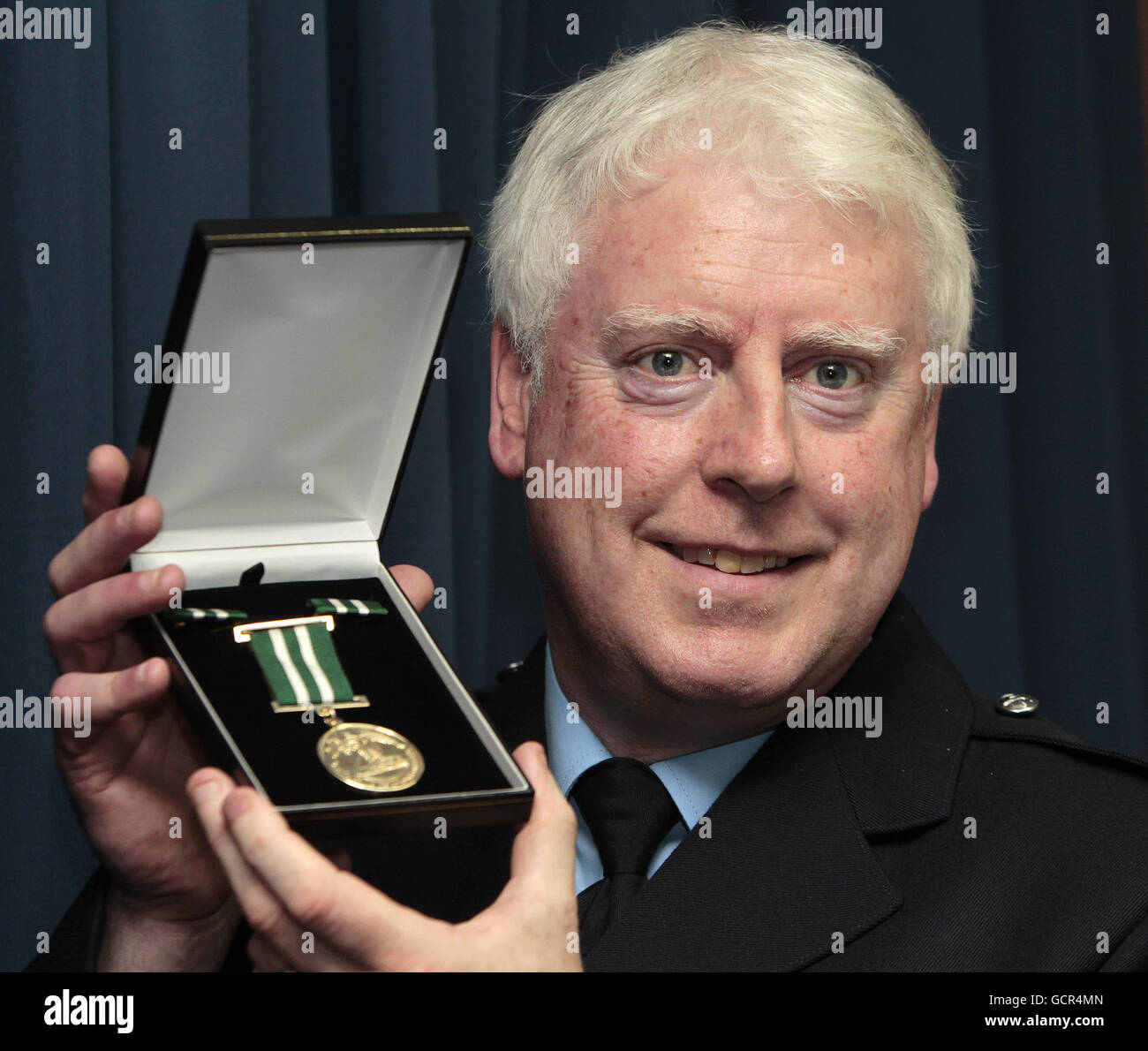 Firefighter Thomas Falconer who was presented with a Gold Bravery award by Ceann Comhairle ...