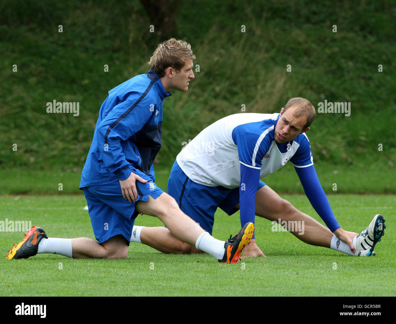 Soccer rangers full length stretching mangsk hi-res stock photography ...