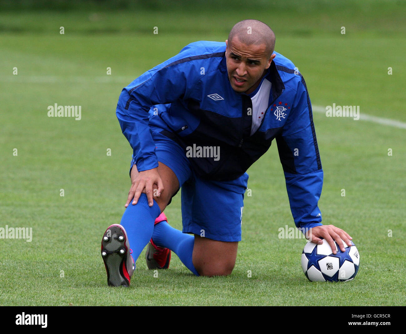 Soccer rangers full length stretching mangsk hi-res stock photography ...