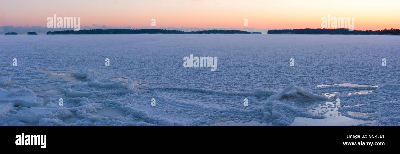 Landscape of winter sunset at frozen sea Stock Photo - Alamy