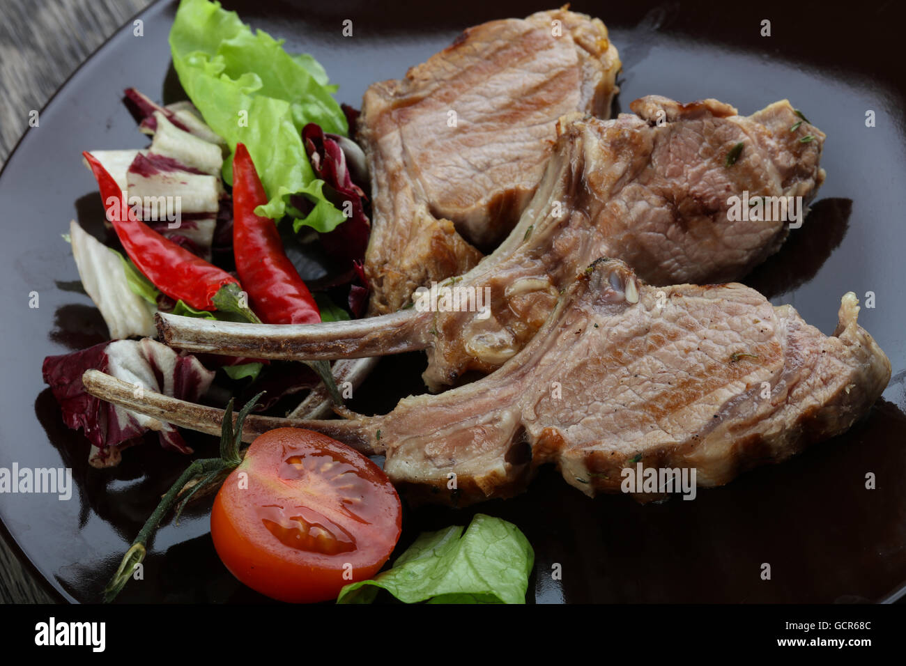 Lamb Frenched Rack grilled rib bone Stock Photo - Alamy