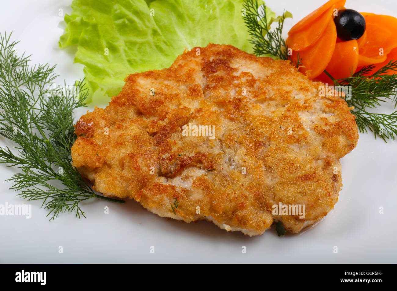 Chicken schnitzel served salad leaves and dill Stock Photo - Alamy