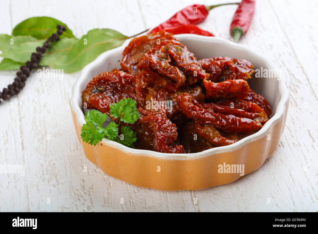 Dry tomato in olive oil with pepper Stock Photo - Alamy