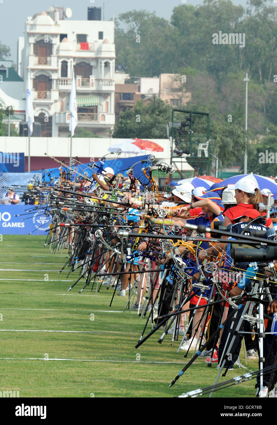 A line of archers compete in the Individual Compound Archery Event ...