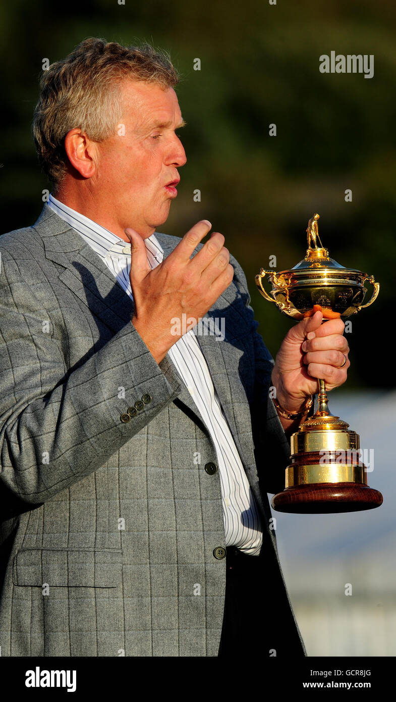 Europes ryder cup captain colin montgomerie poses with the trophy hi ...