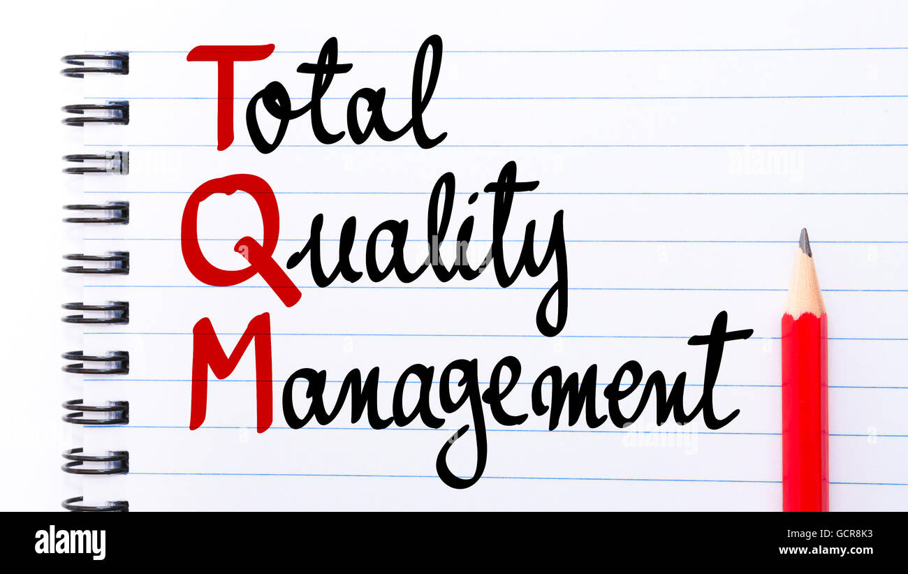 TQM Total Quality Management written on notebook page with red pencil ...