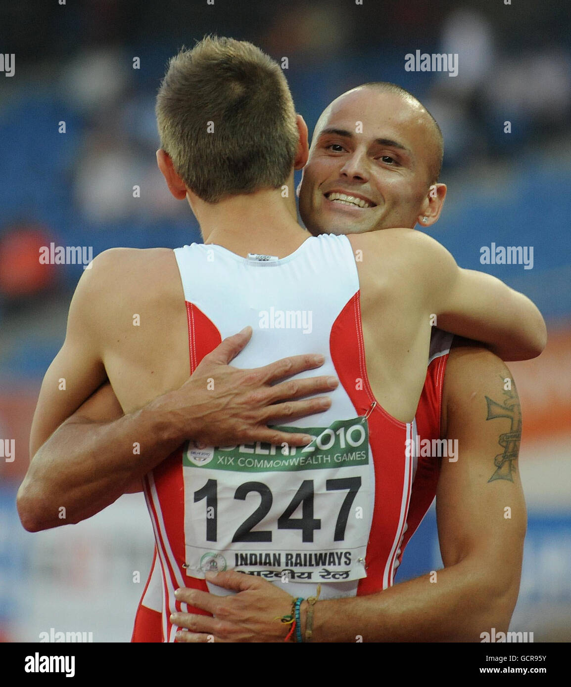 England's Andy Turner celebrates his victory with third placed England ...