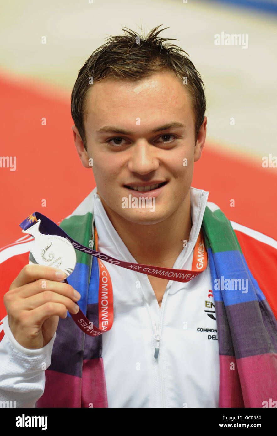 England's Anthony James celebrates winning silver in the 100 meters ...