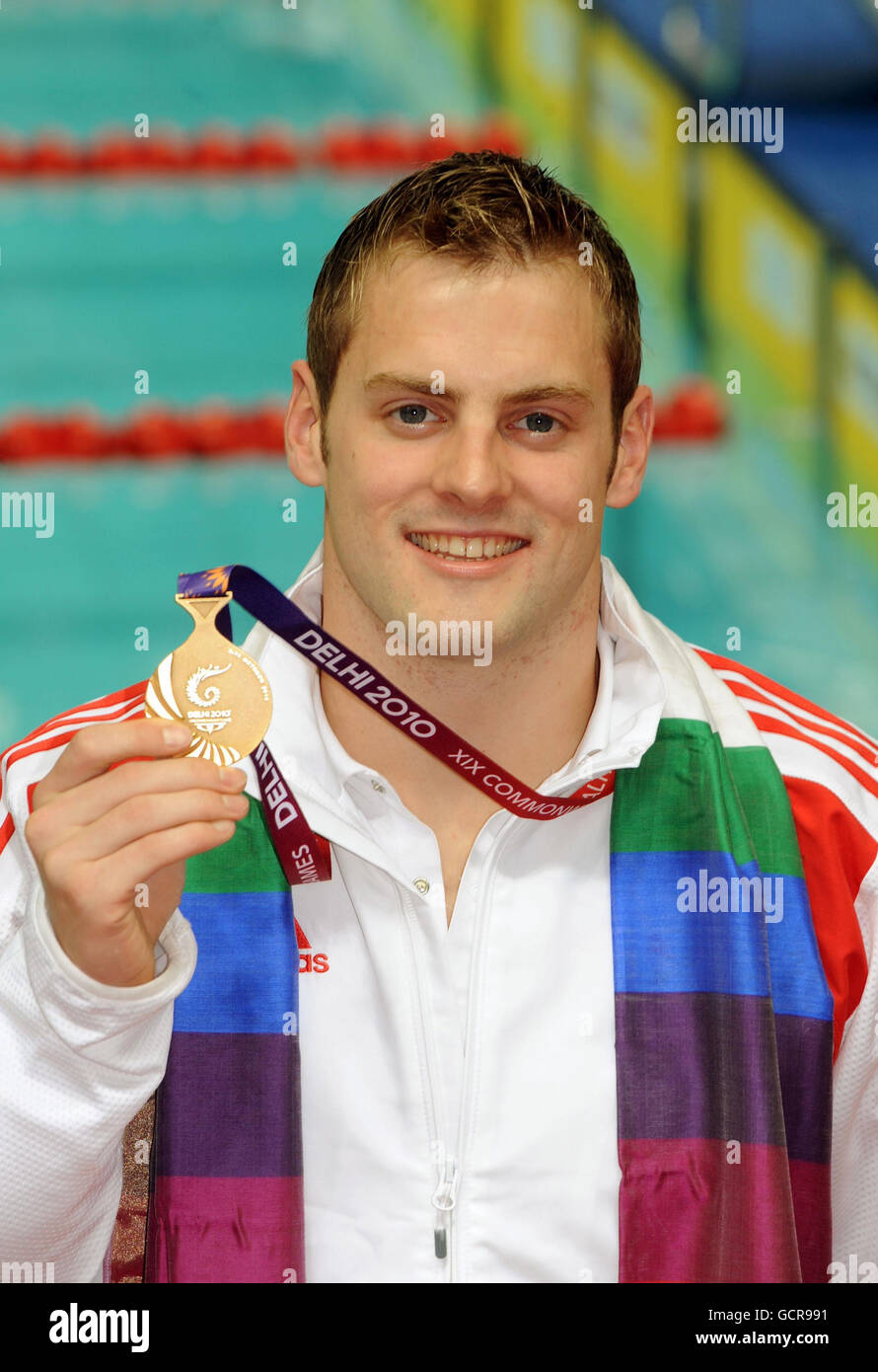 England's Liam Tancock celebrates winning gold in the men's 100 meters ...