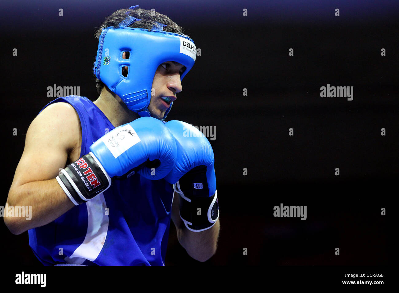 Pakistan's Haroon Kahn (blue) in action against Wales' Andrew Selby in ...