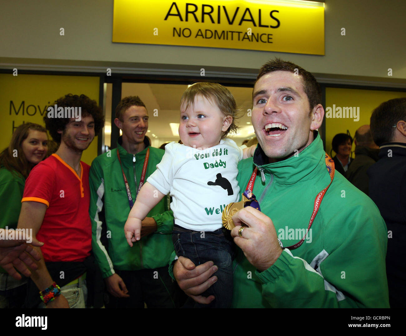 Boxer Eamonn O'Kane with his Gold medal and daughter Charlie, 13 months ...