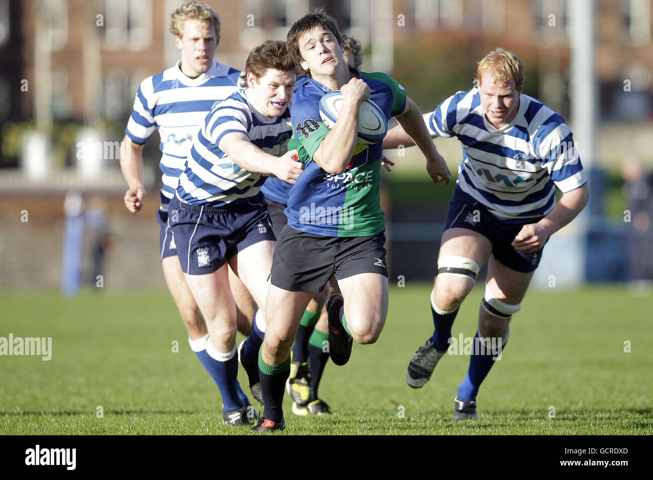 Boroughmuir's Harry Leonard escapes the grasp of Heriots' Greg Walker ...