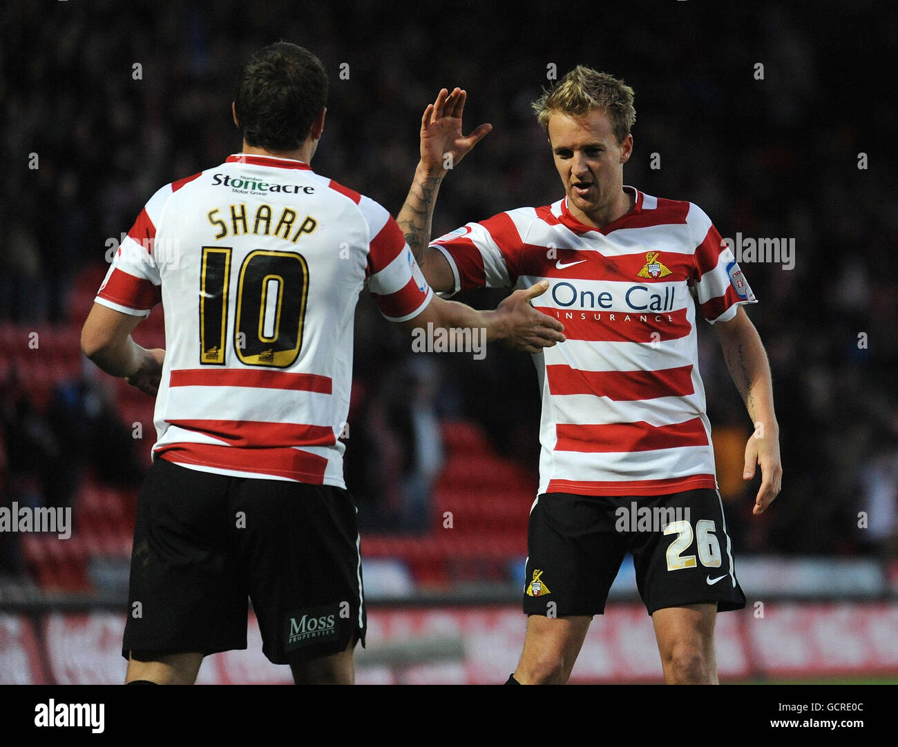 Doncaster Rovers' James Coppinger (right) celebrates his goal with ...