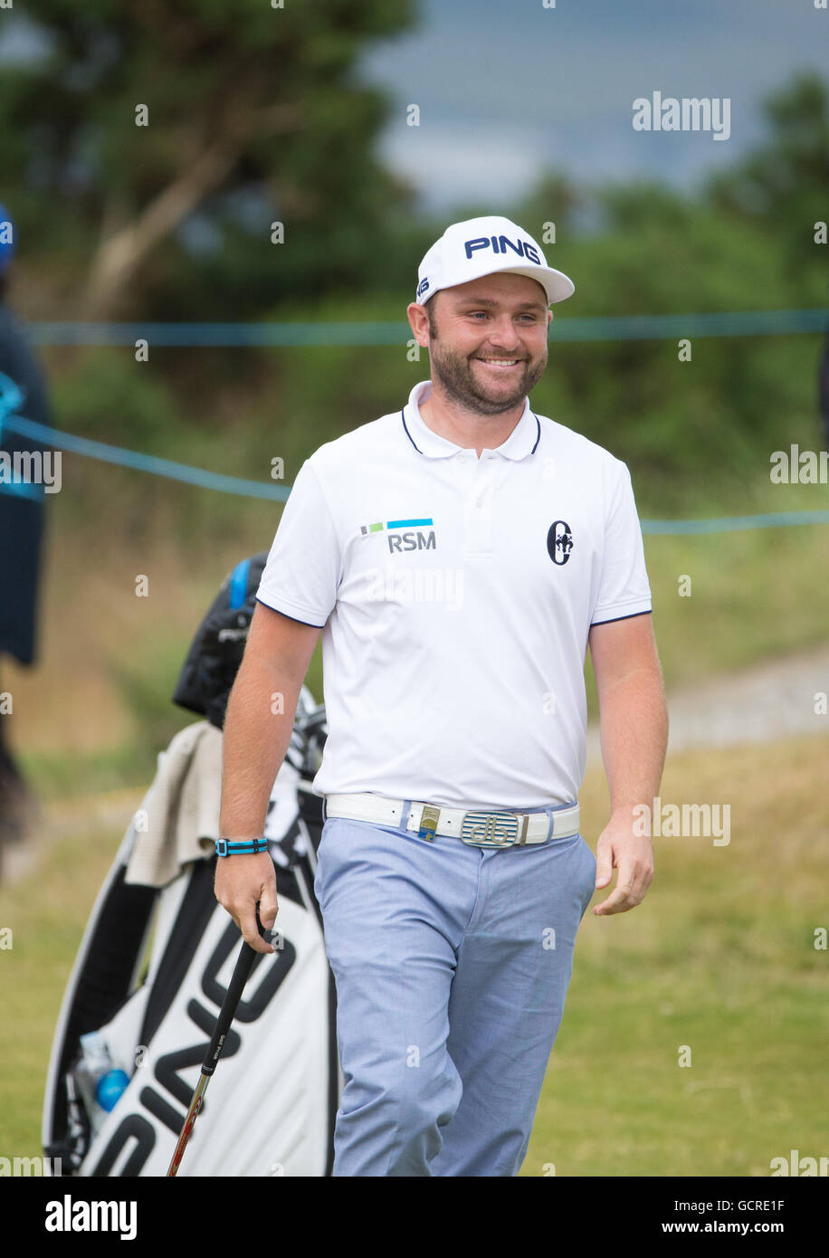 England's Andy Sullivan is all smiles after playing from the green side ...