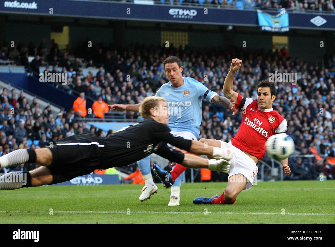 Manchester City's goalkeeper Joe Hart saves ahead of Arsenal's Francesc ...