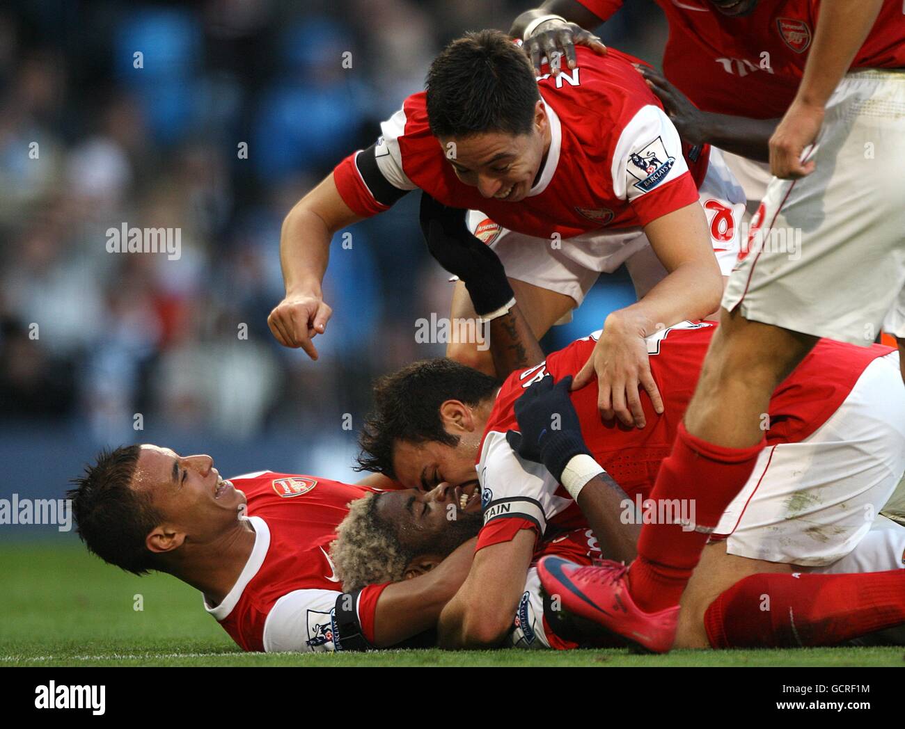 Arsenal's Alex Song celebrates scoring his sides second goal with his ...