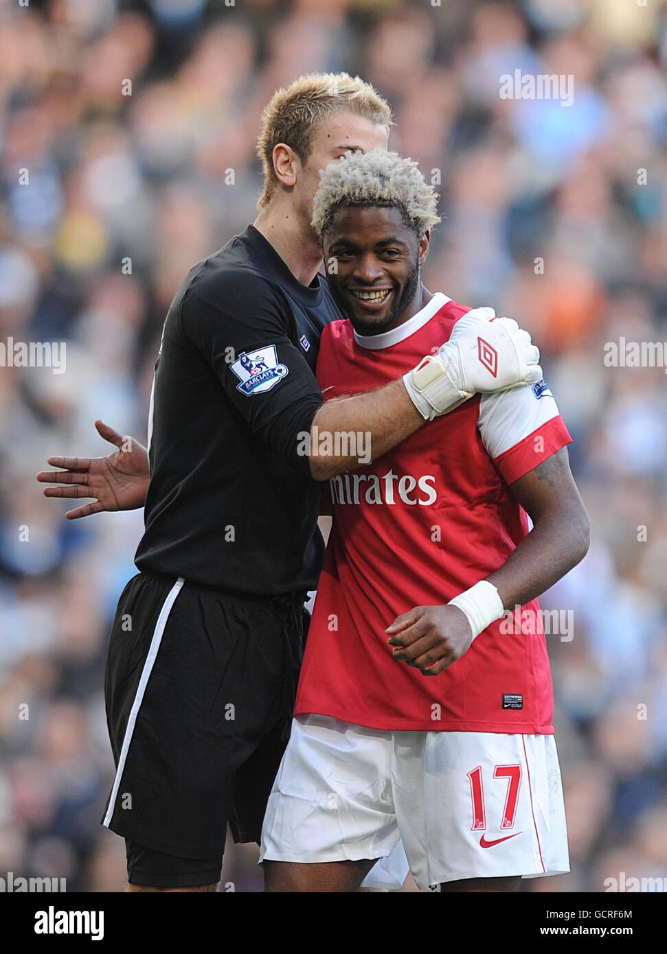 Manchester City goalkeeper Joe Hart (left) with Arsenal's Alex Song ...