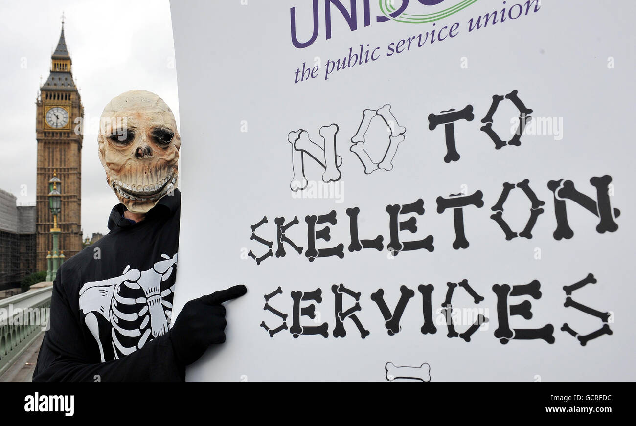 A member of the union Unison dressed in a skeleton costume on ...