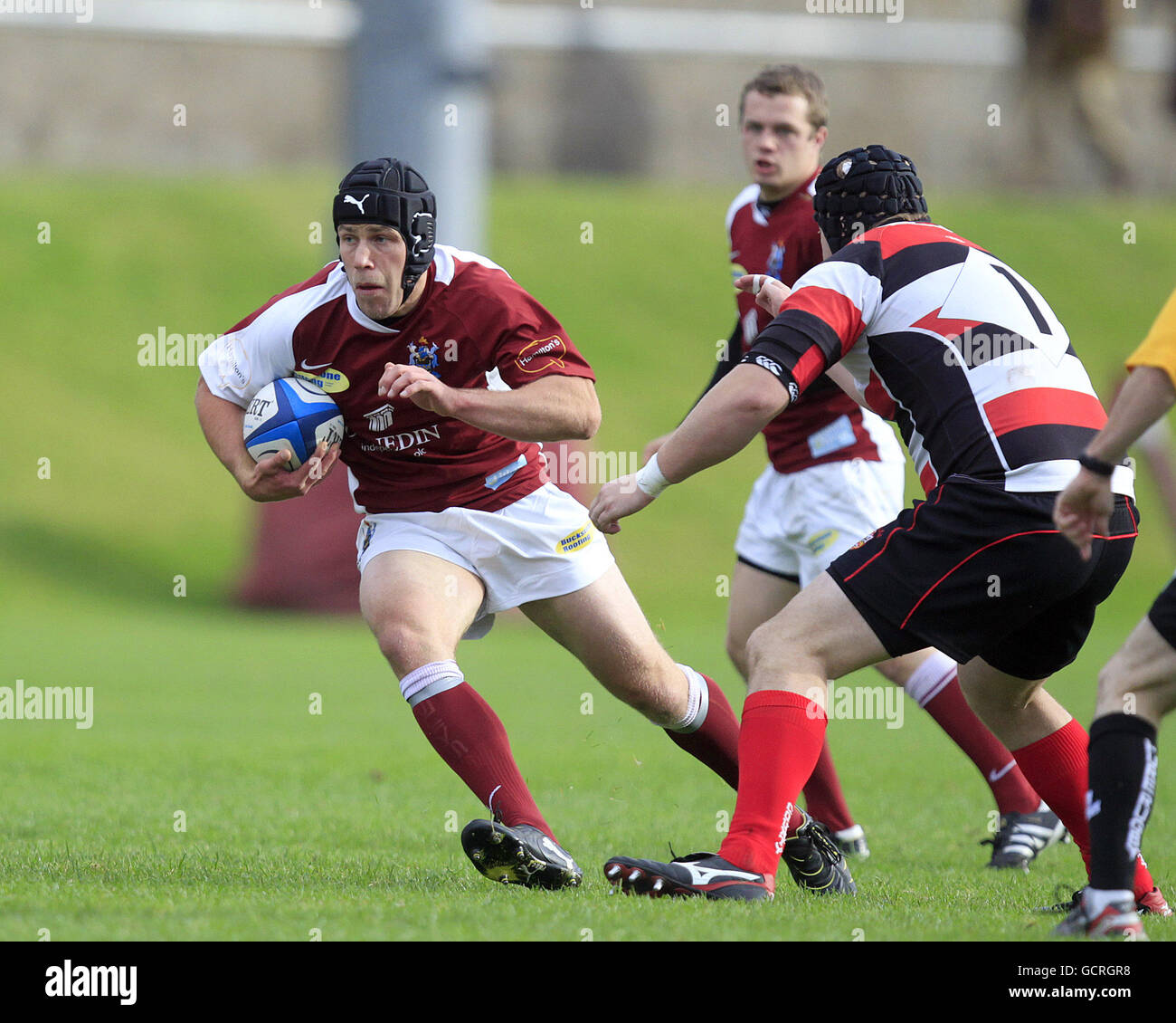 Watsonians and Edinburgh winger, Simon Webster (left) attacks past ...