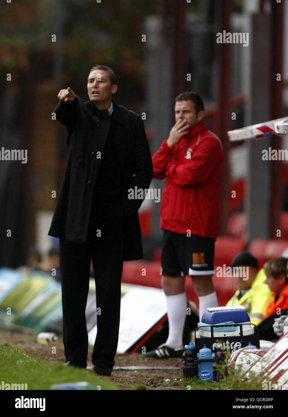Brentford manager Andy Scott shouts instructions in front of Charlton ...