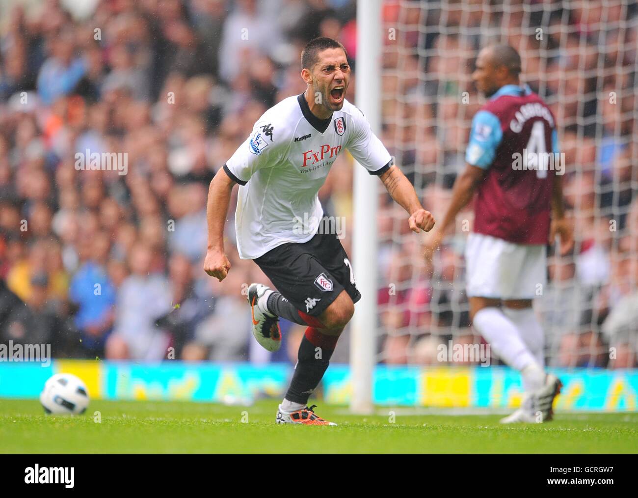 Fulham's Clint Dempsey celebrates after scoring the opening goal of the ...