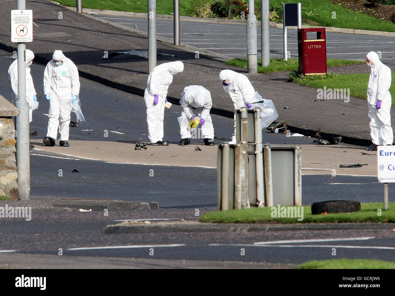 Forensics officers at the scene in Londonderry, after a car bomb ...