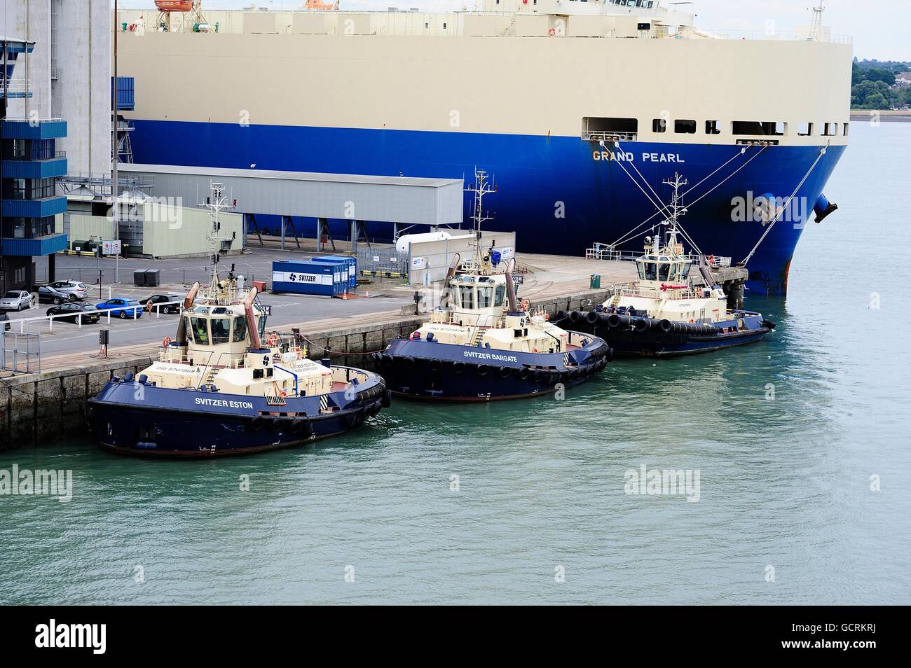 Three Tug Boats in a line Stock Photo - Alamy