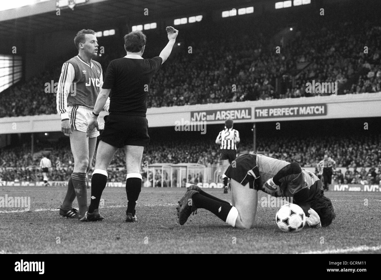 Referee Brian Hill beckons help for Newcastle United's goalkeeper Gary ...