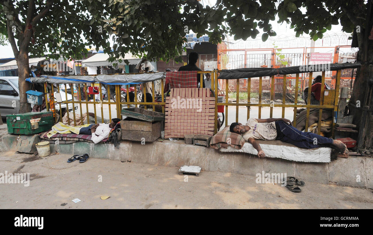A general view showing people living on the street in Old Delhi, India ...