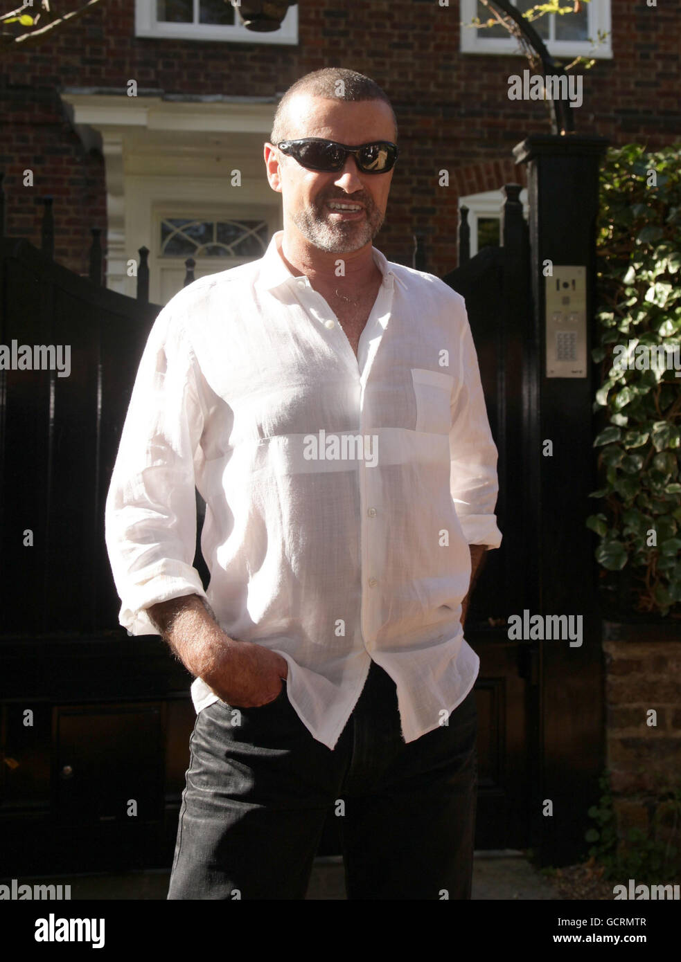 Pop star George Michael speaks outside his house is Highgate, north ...