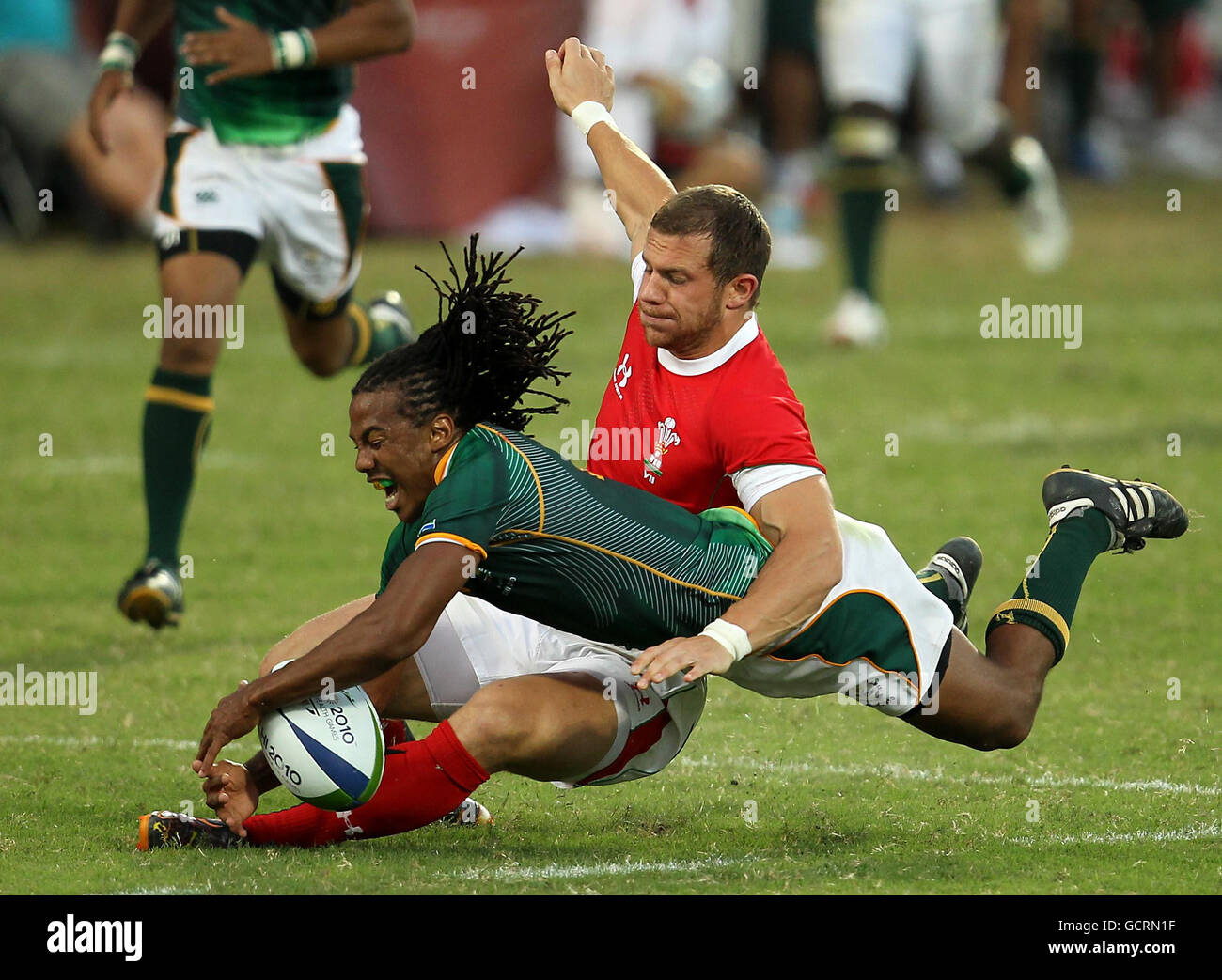 Wales' Ifan Evans and South Africa's Cecil Afrika in action during Day ...