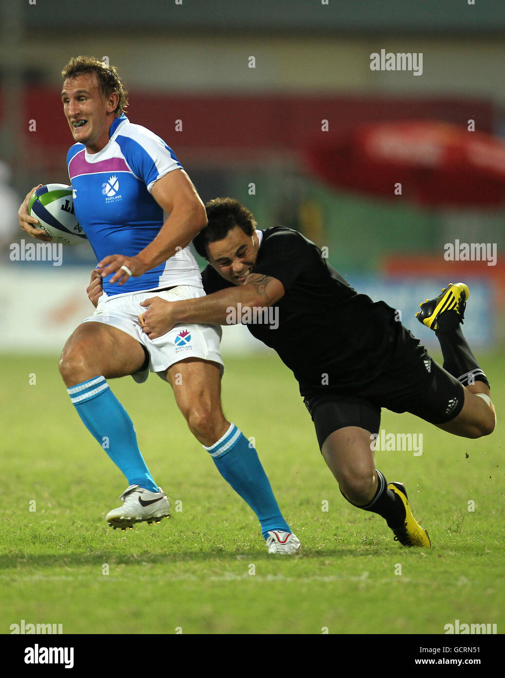 Scotland's Colin Shaw (left) and New Zealand's Zac Guildford (right) in ...
