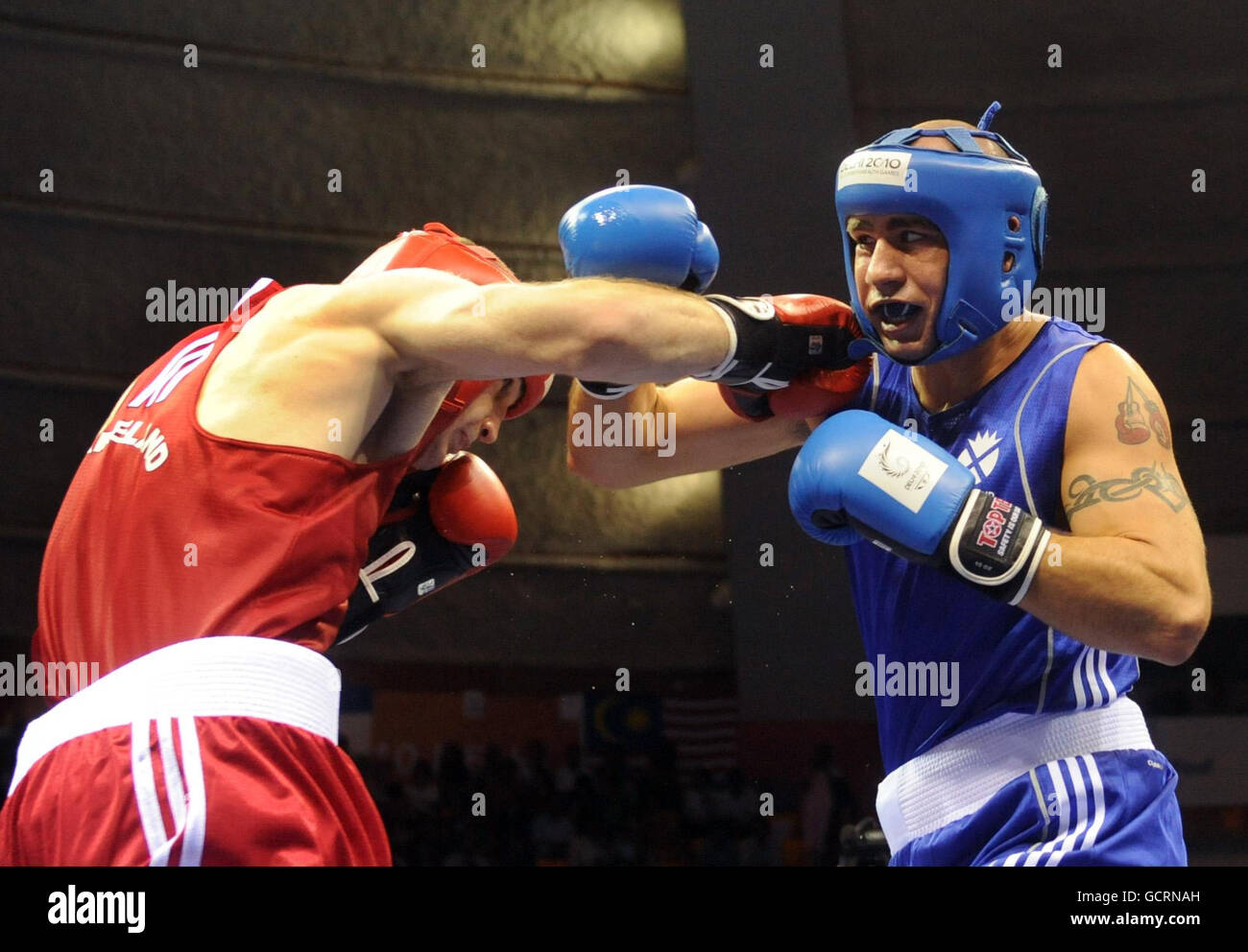 Scotland's Steven Simmons (blue) competes against Northern Ireland's ...