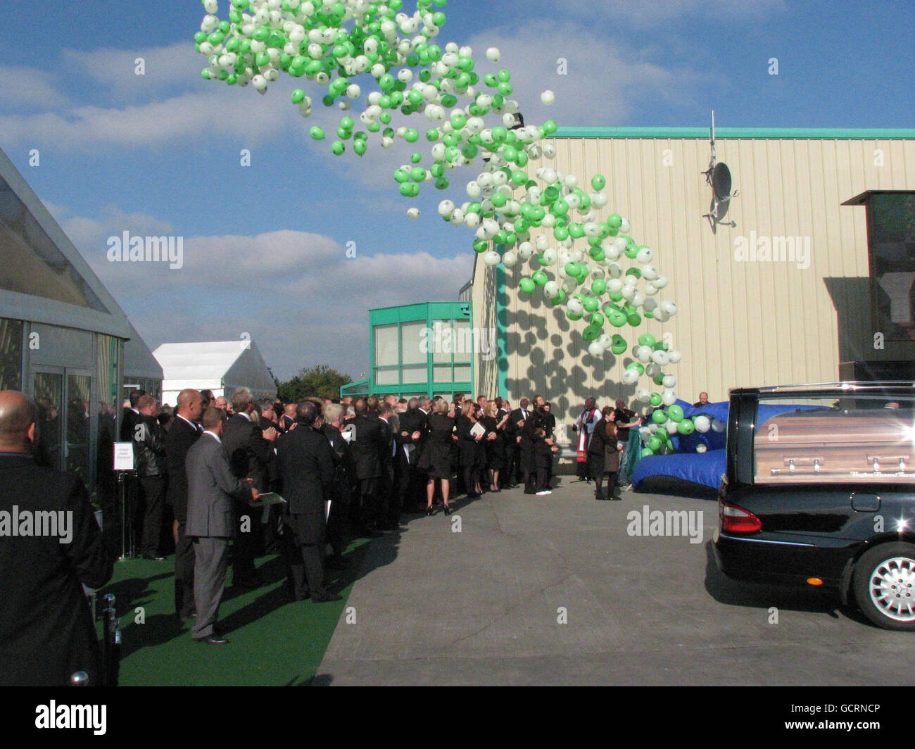 Balloons are released as the coffin of Jimi Heselden leaves a specially ...