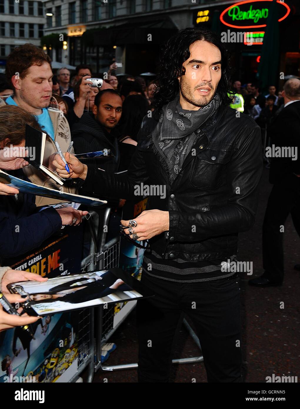 Russell Brand signs autographs for fans while arriving for the European ...