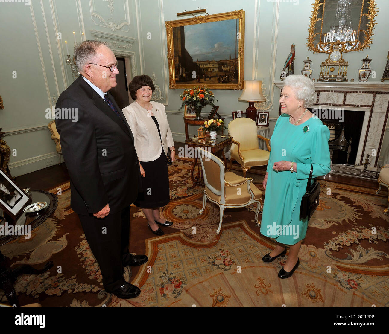 Queen Elizabeth II shakes hands with the Lieutenant Governor of Alberta ...
