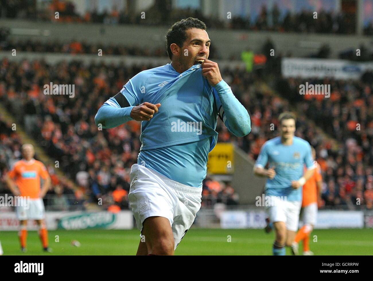 Manchester City's Carlos Tevez celebrates after scoring his side's ...