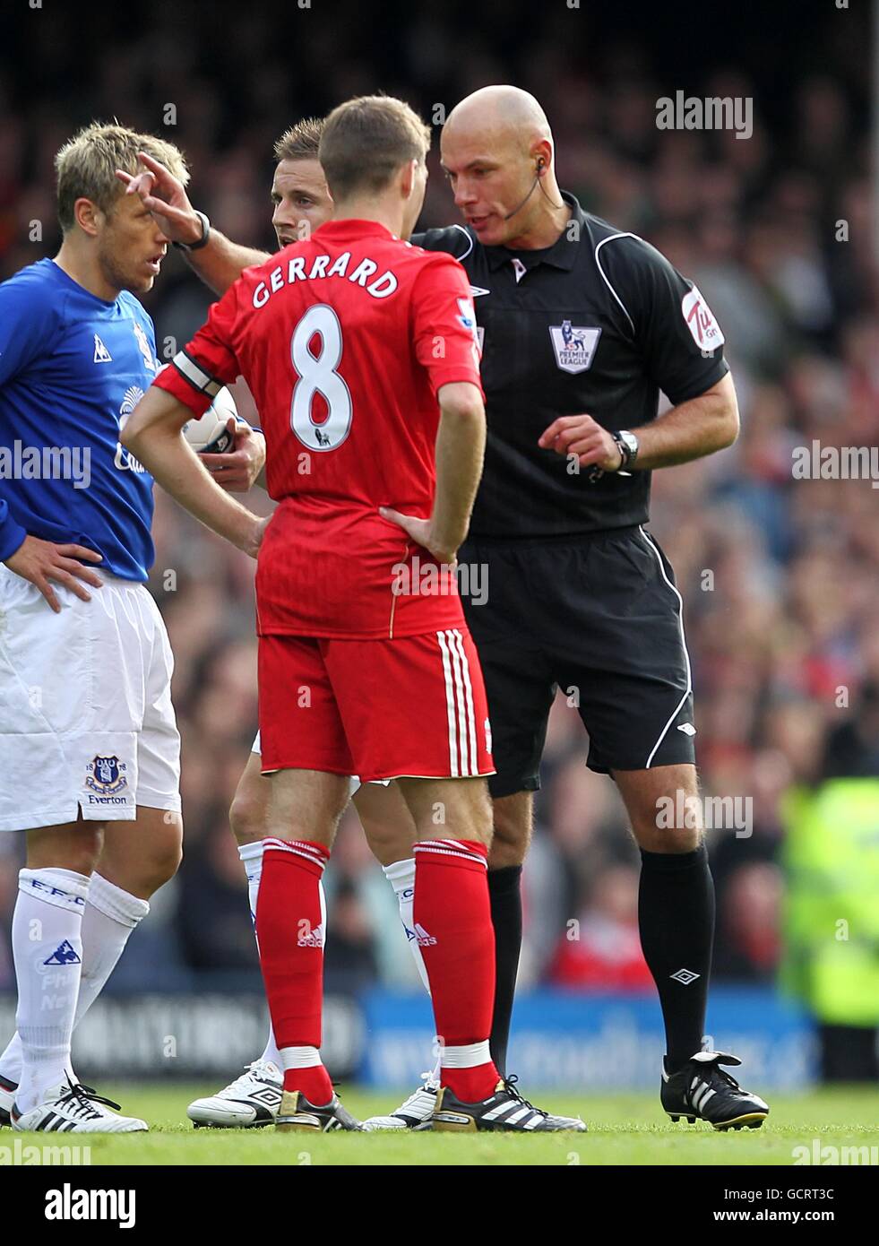 Liverpool's Steven Gerrard (left) remonstrates with referee Howard Webb ...