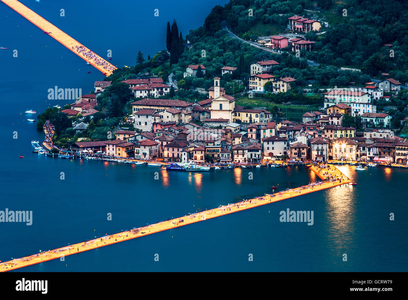 The Floating Piers Christo project. Visitors walking from Sulzano to ...