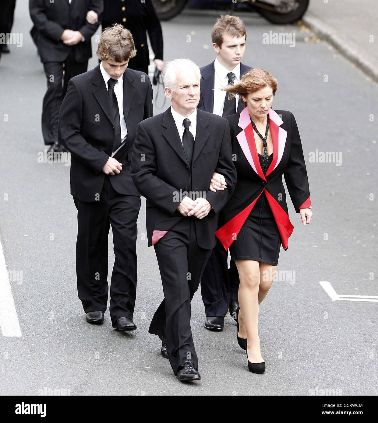 Sir Norman Wisdom's children Nick and Jacqui (front) make their way to ...