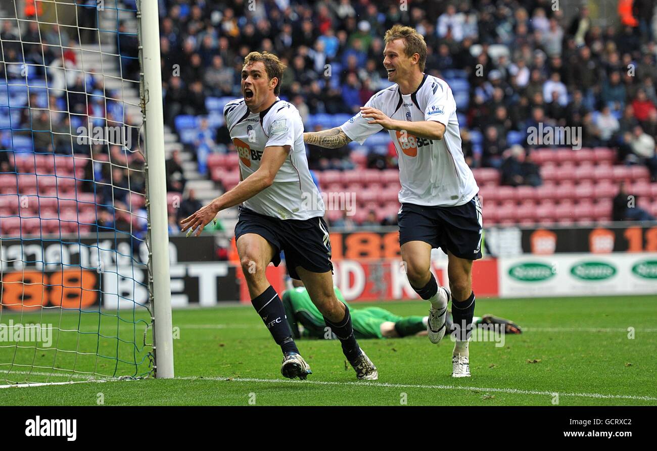 Bolton Wanderers' Johan Elmander (left) celebrates with team mate ...