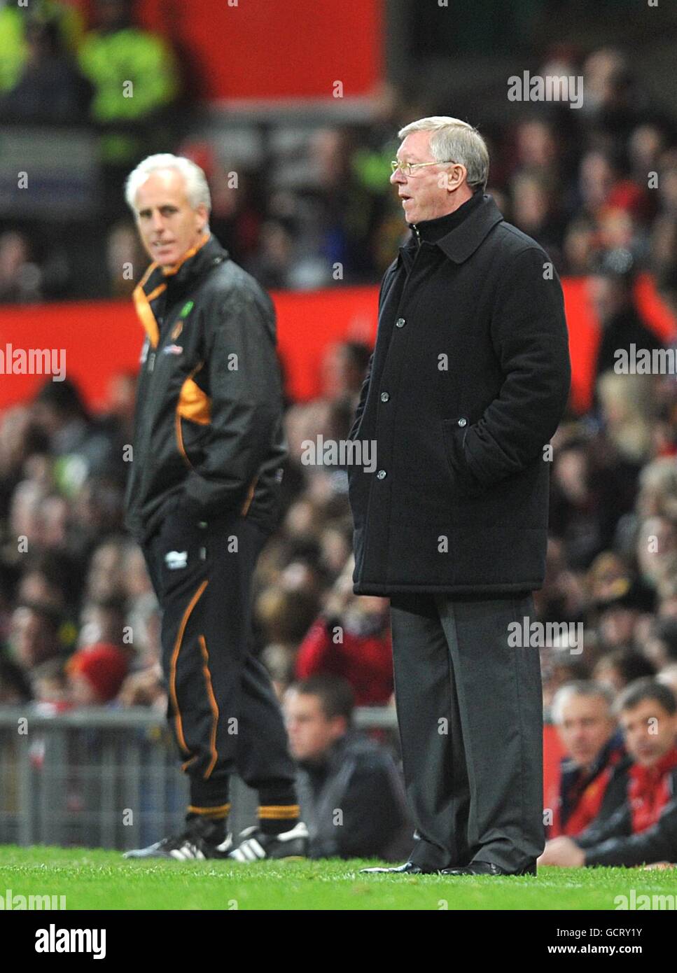 Wolverhampton Wanderers manager Mick McCarthy (left) and Manchester ...
