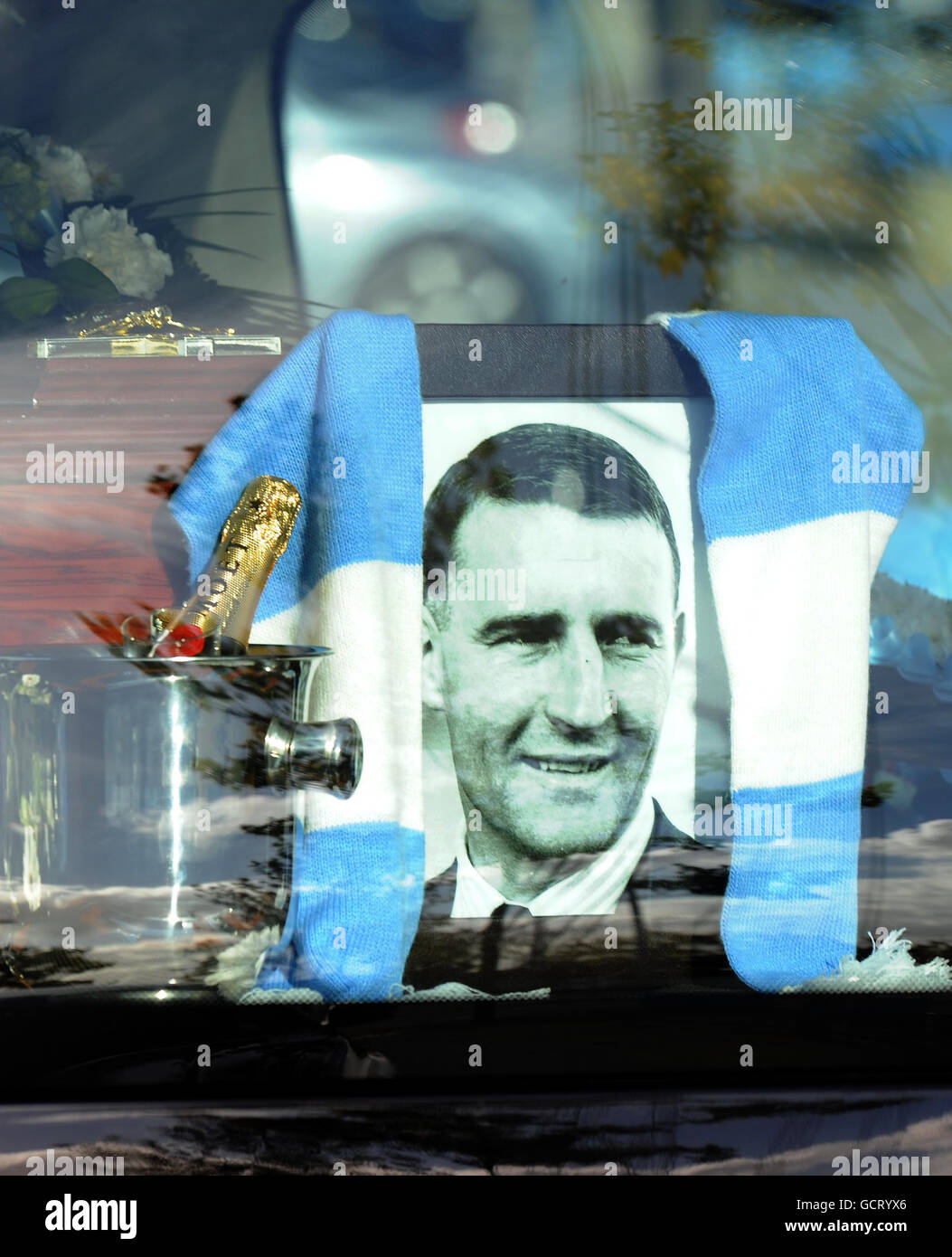 The hearse carrying the coffin of Malcolm Allison with a picture of the ...