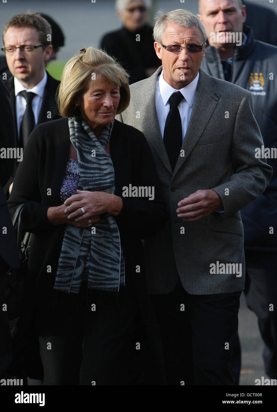 Former Manchester City player Colin Bell, centre right, arrives for the ...
