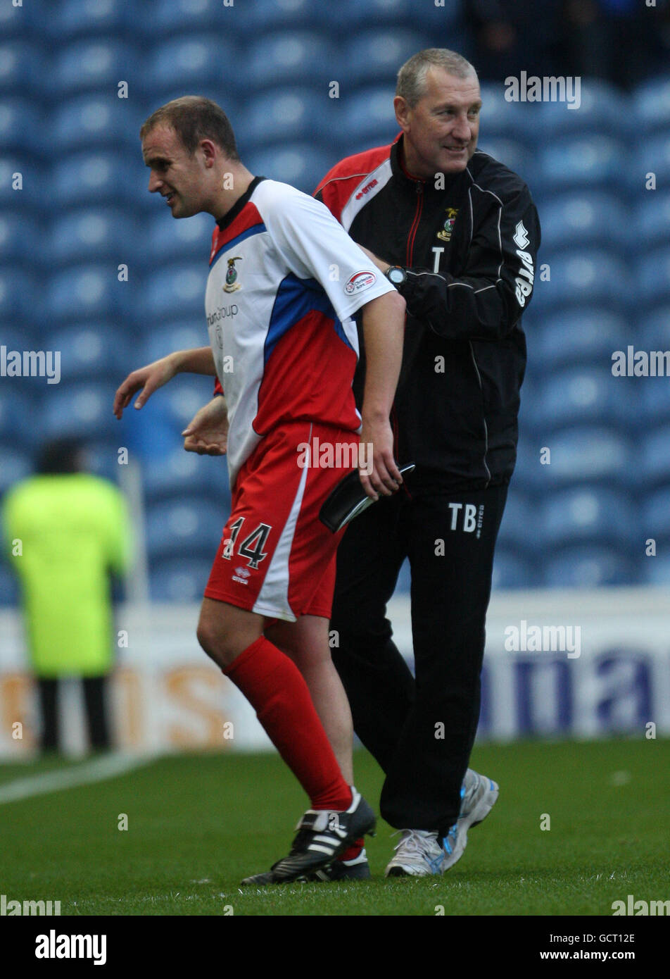 Inverness manager Terry Butcher celebrates with Grant Munro (left ...